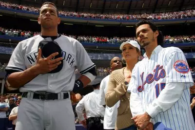 jlo arod and marc Anthony in a baseball game papo